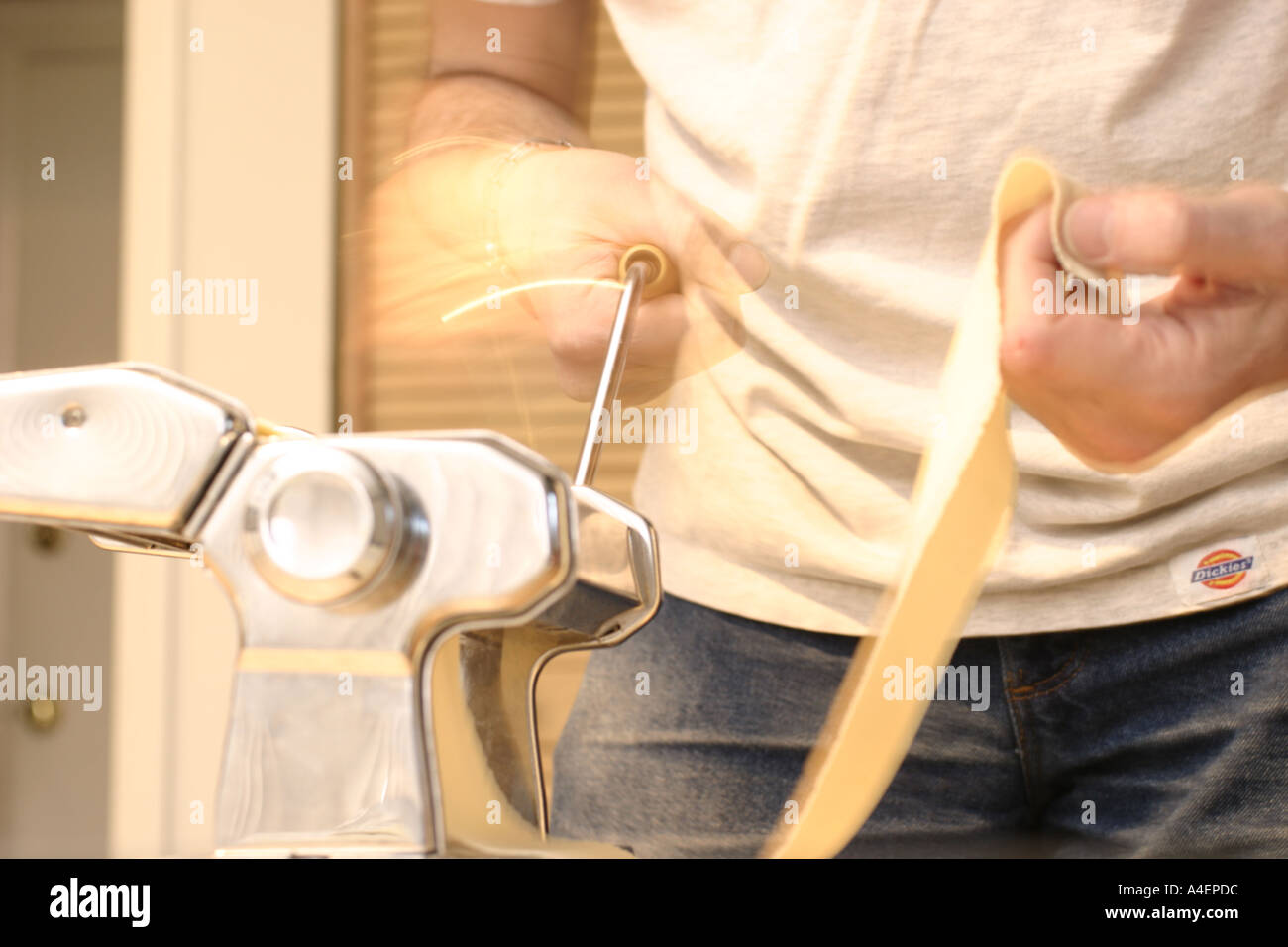 Making fresh pasta with a hand-cranked pasta machine Stock Photo - Alamy