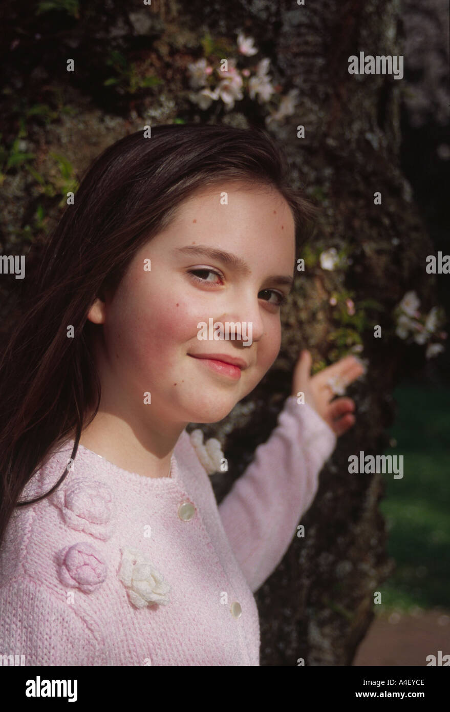 A smiling Russian girl in pink knitted jacket Stock Photo - Alamy