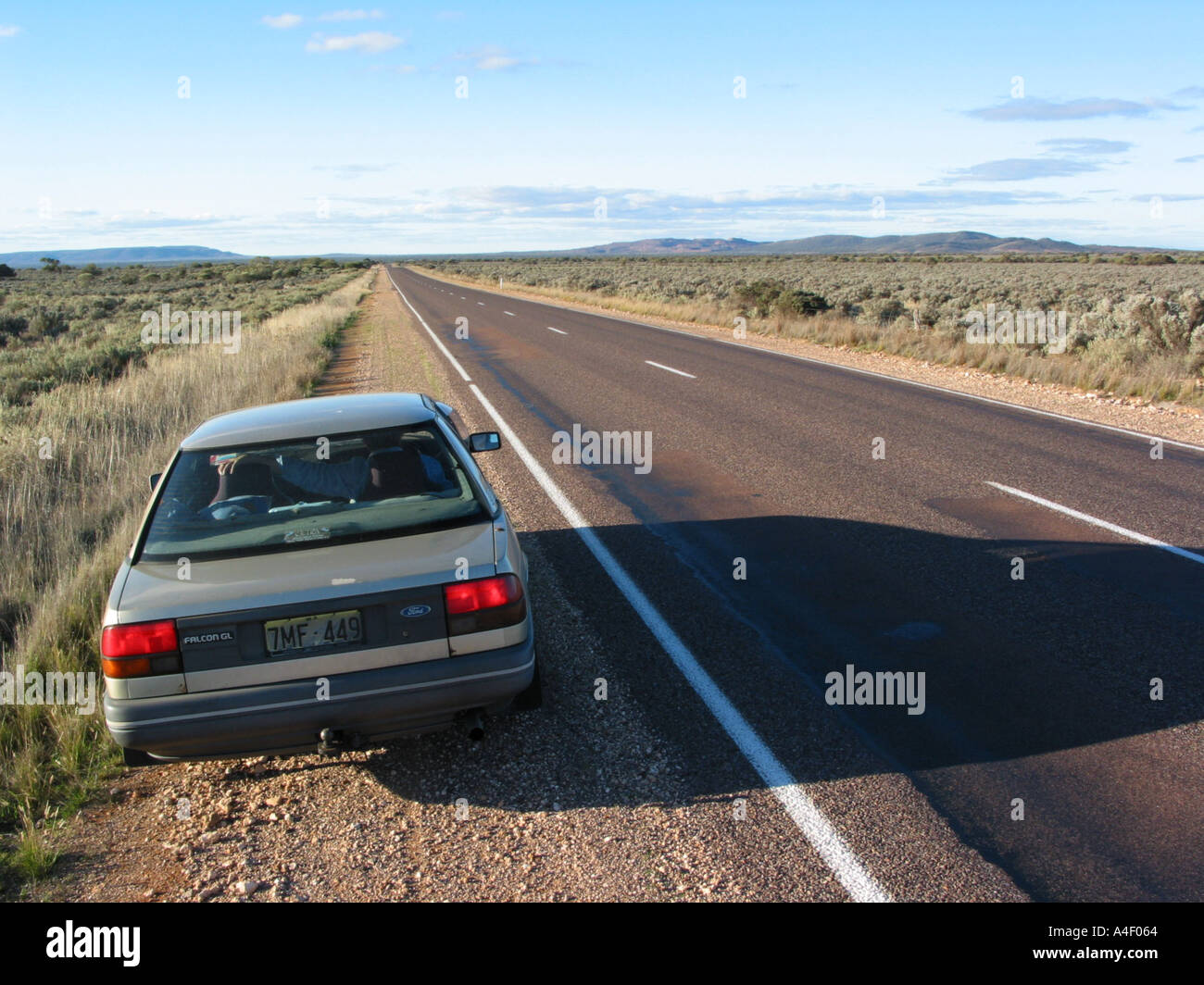 Car on straight road Stock Photo - Alamy