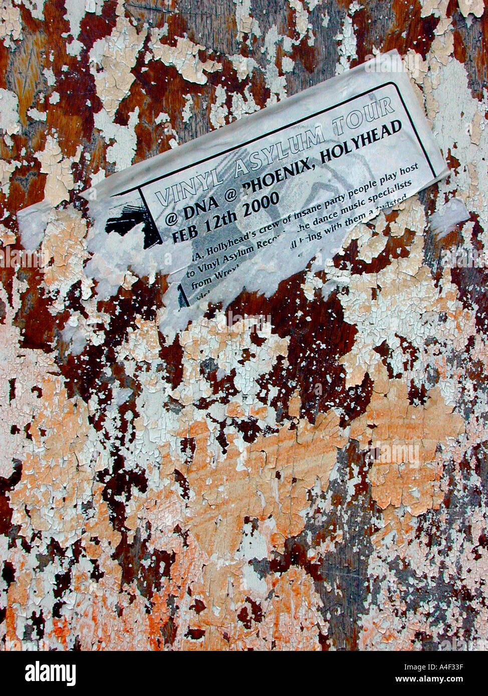 Peeling flaking paintwork with torn poster Stock Photo - Alamy
