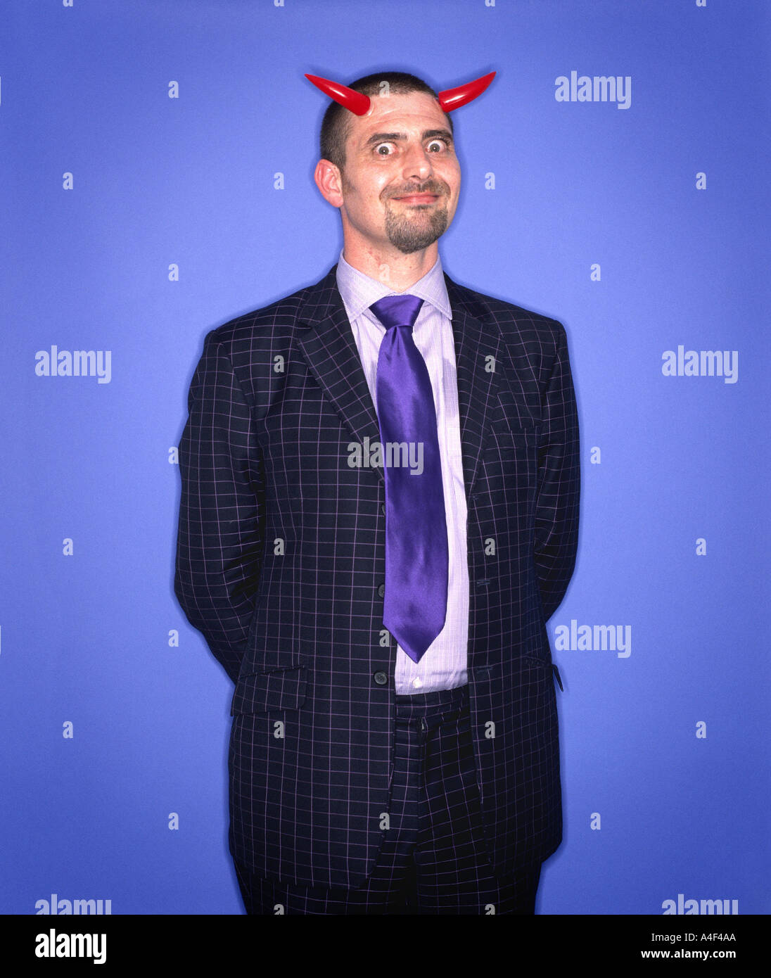 Devil man blue background Stock Photo - Alamy