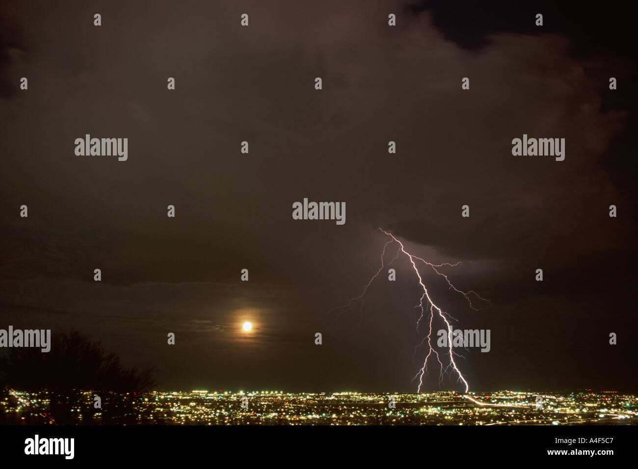Lightning with the moon Stock Photo - Alamy