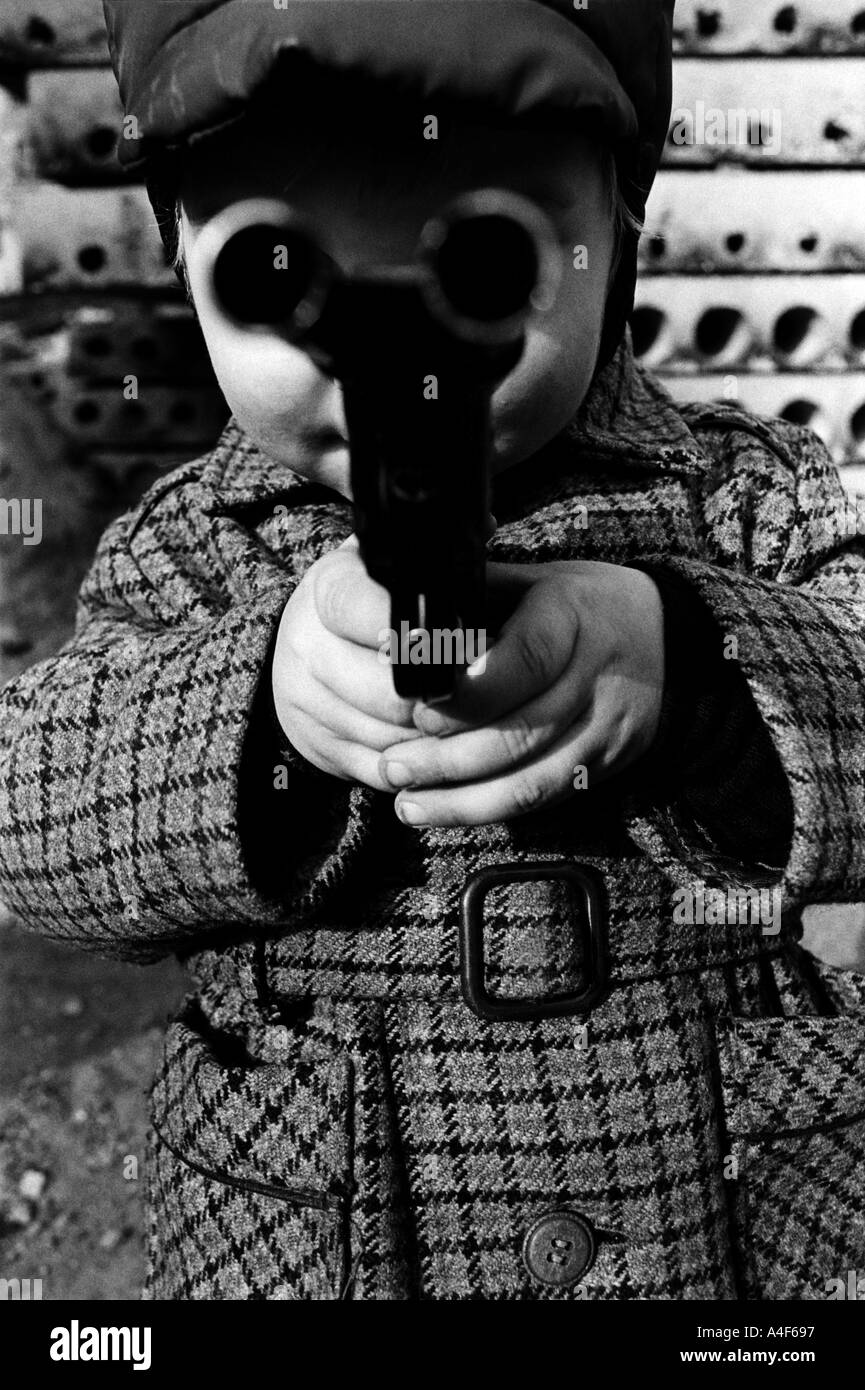 A little boy pointing with a gun Stock Photo - Alamy