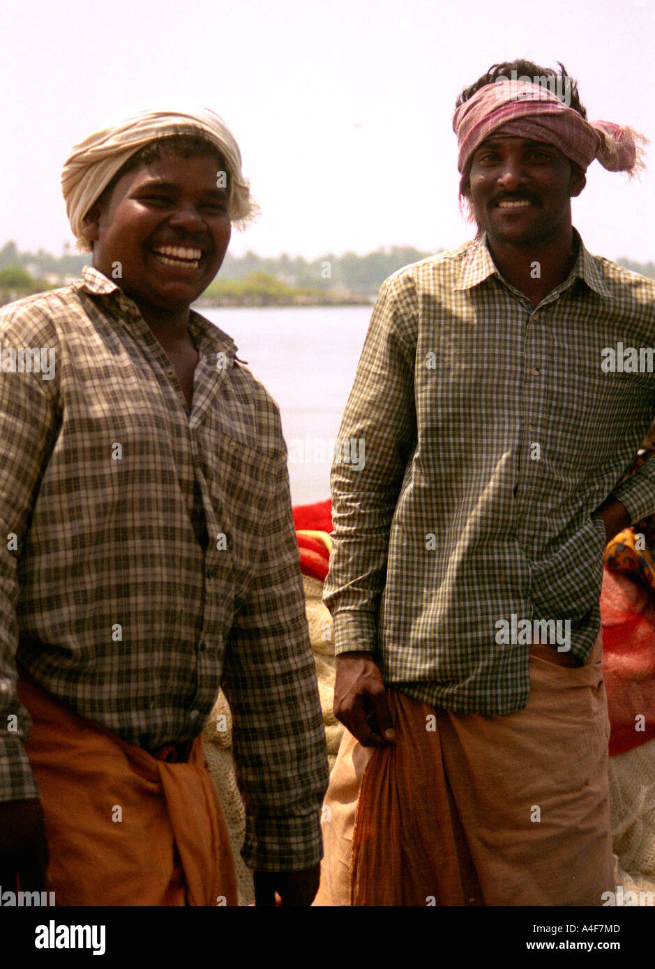 Two fishermen at a market in kerala hi-res stock photography and images ...