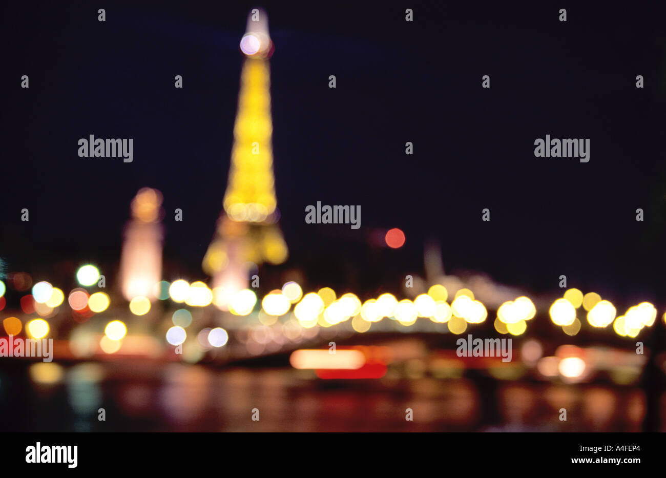 blurred image of Eiffel Tower in Paris France at night Stock Photo - Alamy