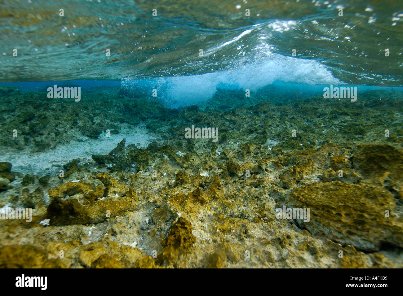 Sea floor and wave breaking Majikin island Namu atoll Marshall Islands ...