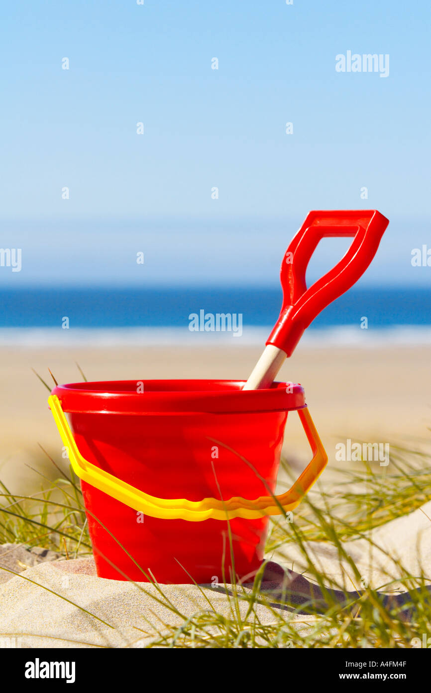 Red Bucket and Spade on Beach Holiday Vacation Concept Portrait Stock ...