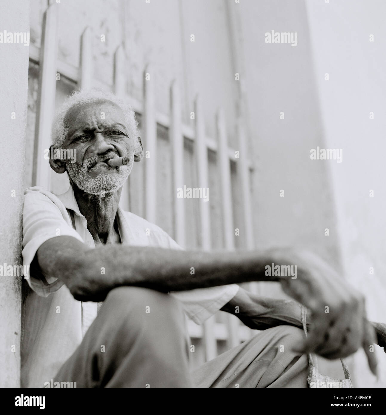 World Cities. Elderly creole Cuban cigar smoker man in the city of ...