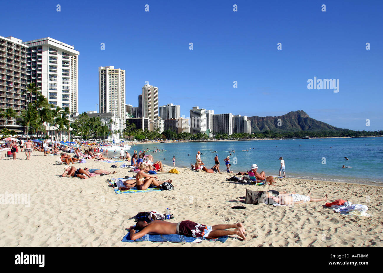 Sunbathing waikiki beach honolulu oahu hi-res stock photography and ...