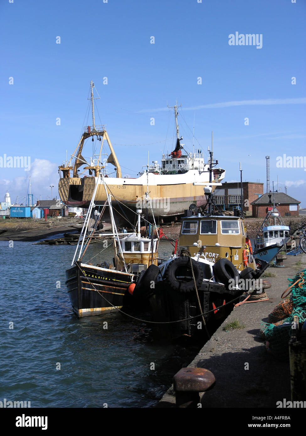 Moored vessels alongside quay in Fleetwood Fish Dock Stock Photo - Alamy