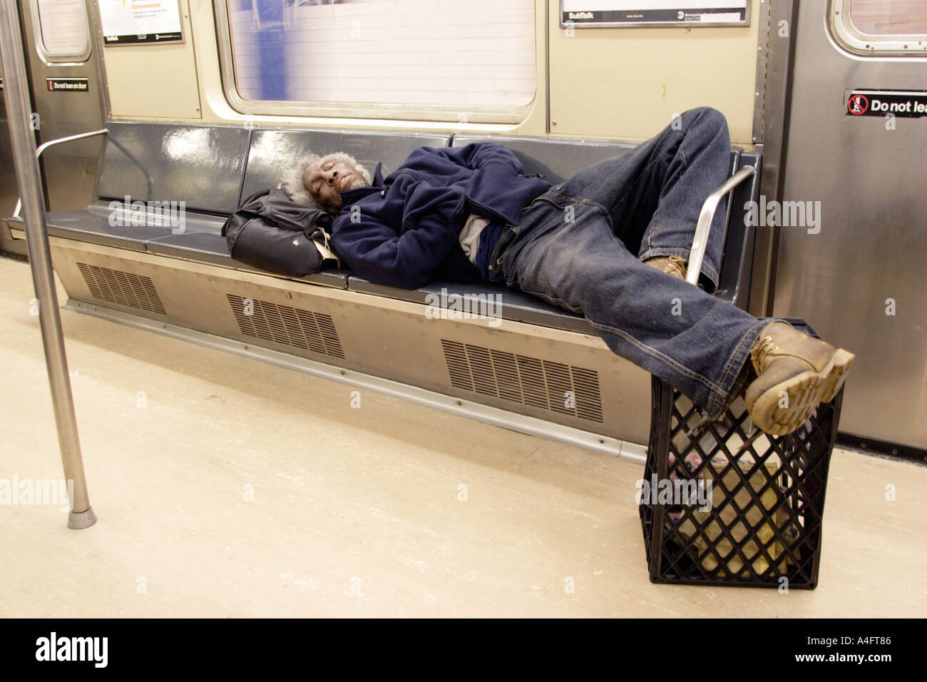 Usa New York homeless person sleeping in the subway Stock Photo - Alamy