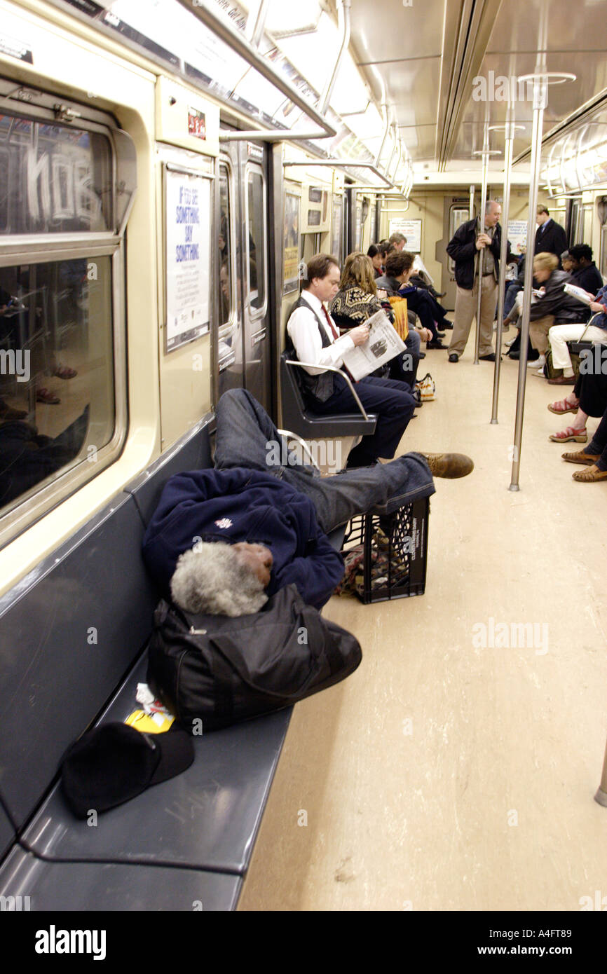 Usa New York homeless person sleeping in the subway Stock Photo - Alamy