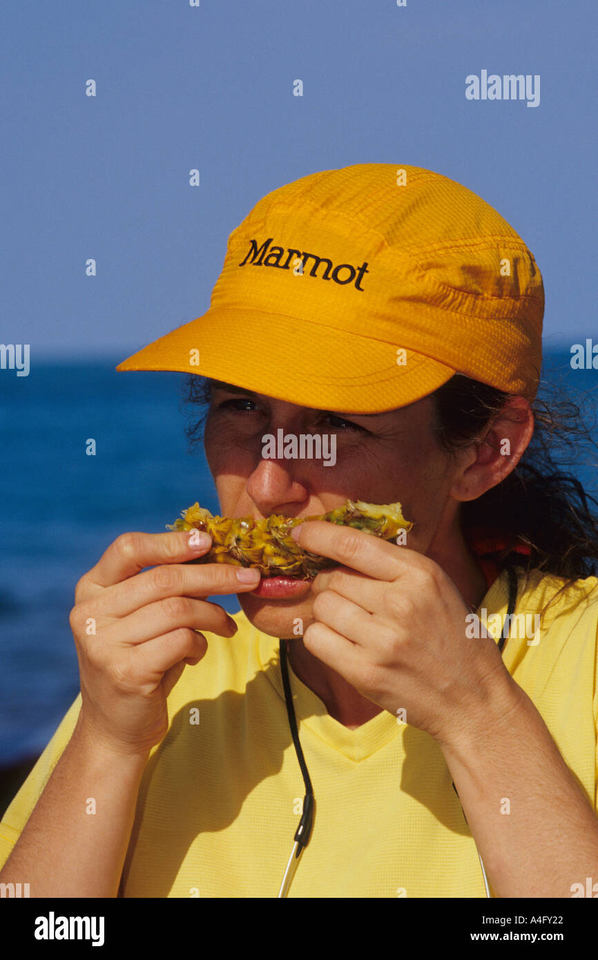 Woman eating pineapple hi-res stock photography and images - Alamy