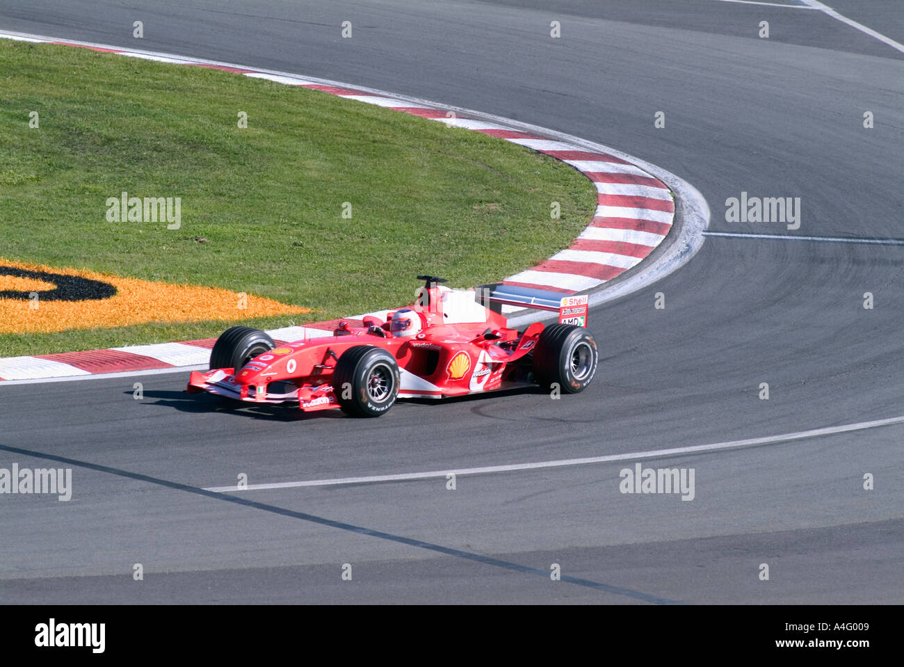Formula 1 racing car red white body in race at turn Gilles Villeneuve ...