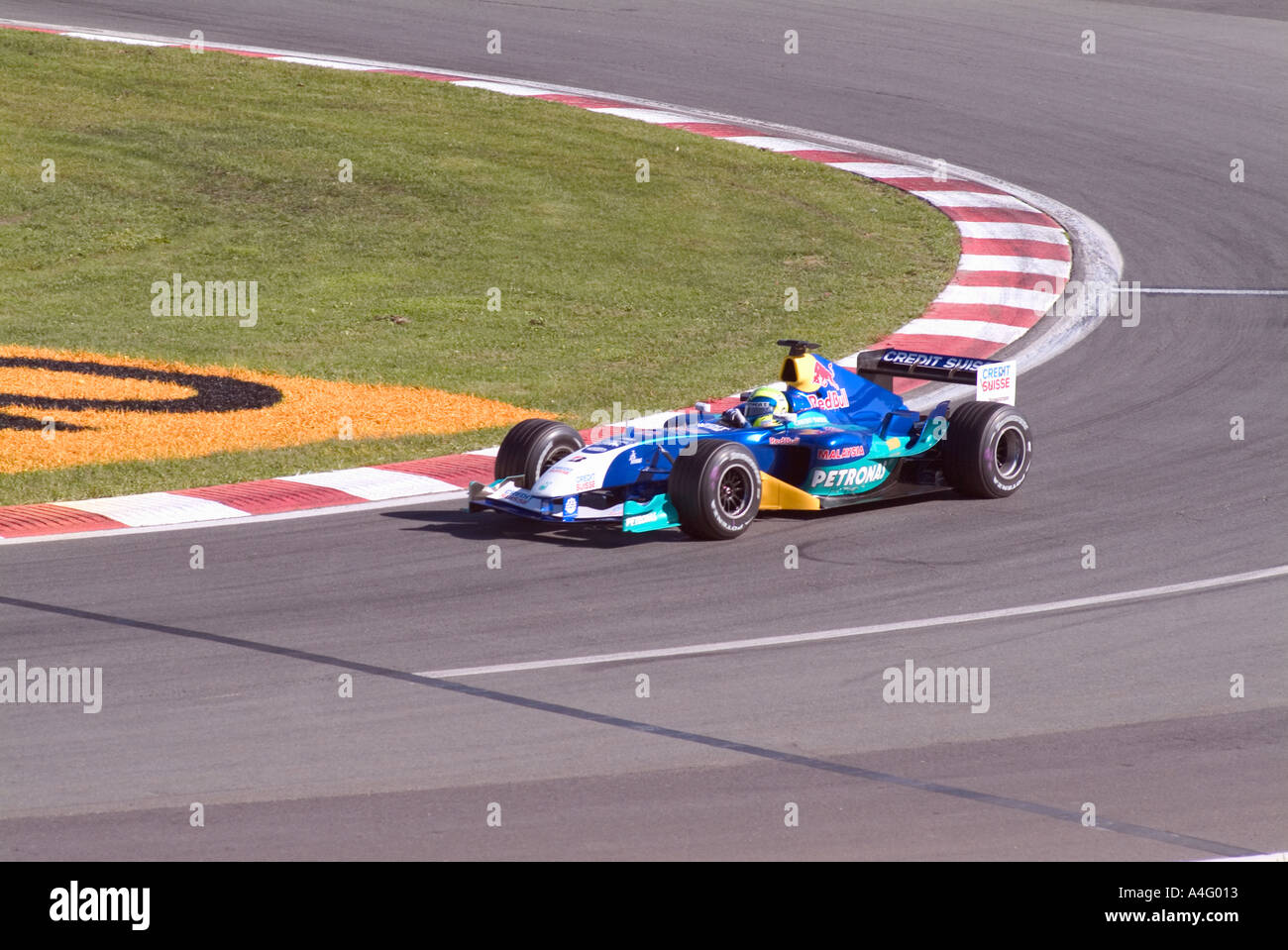 Formula 1 racing car blue green body in race at turn Gilles Villeneuve ...