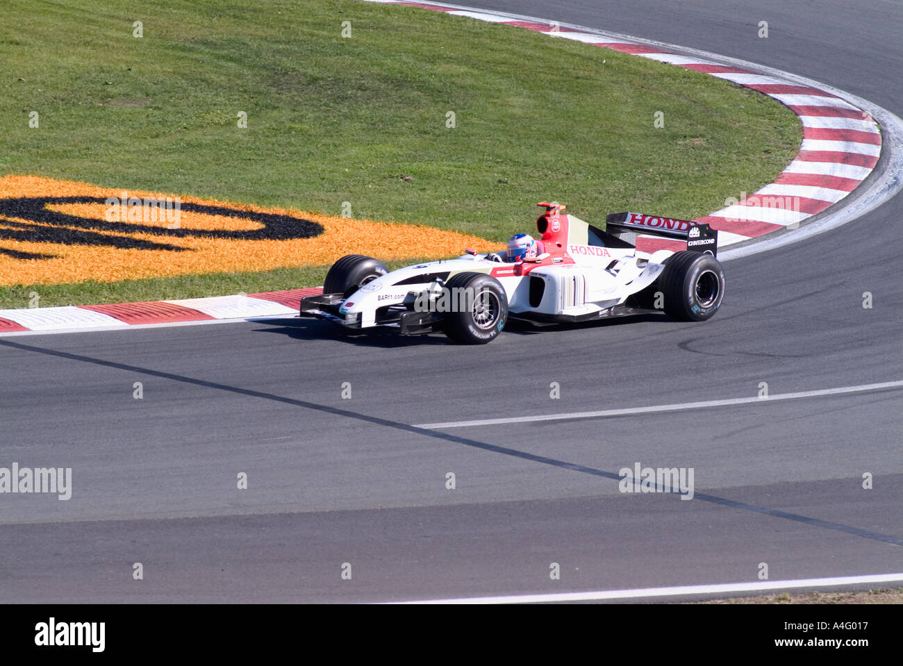Formula 1 racing car red white body in race at turn Gilles Villeneuve ...