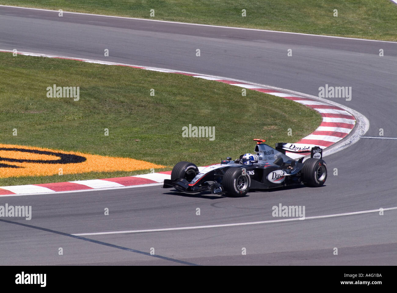 Formula 1 racing car grey white blue red body in race at curve Gilles ...