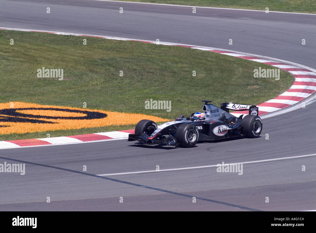 Formula 1 race car grey blue white red body in race at curve Gilles ...