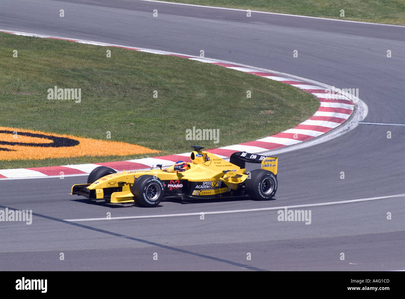 At race yellow colour body formula 1 car in turn Gilles Villeneuve Race ...