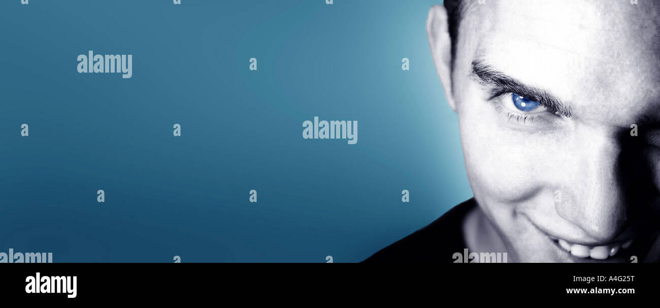 Man Blue eyes on blue blackground with a big toothy smile Stock Photo ...