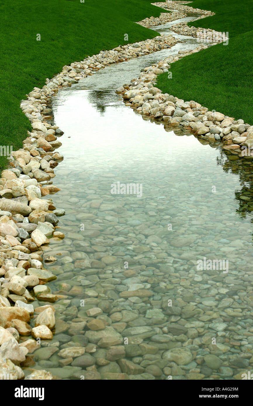 Stream flowing downward in green nature Stock Photo - Alamy