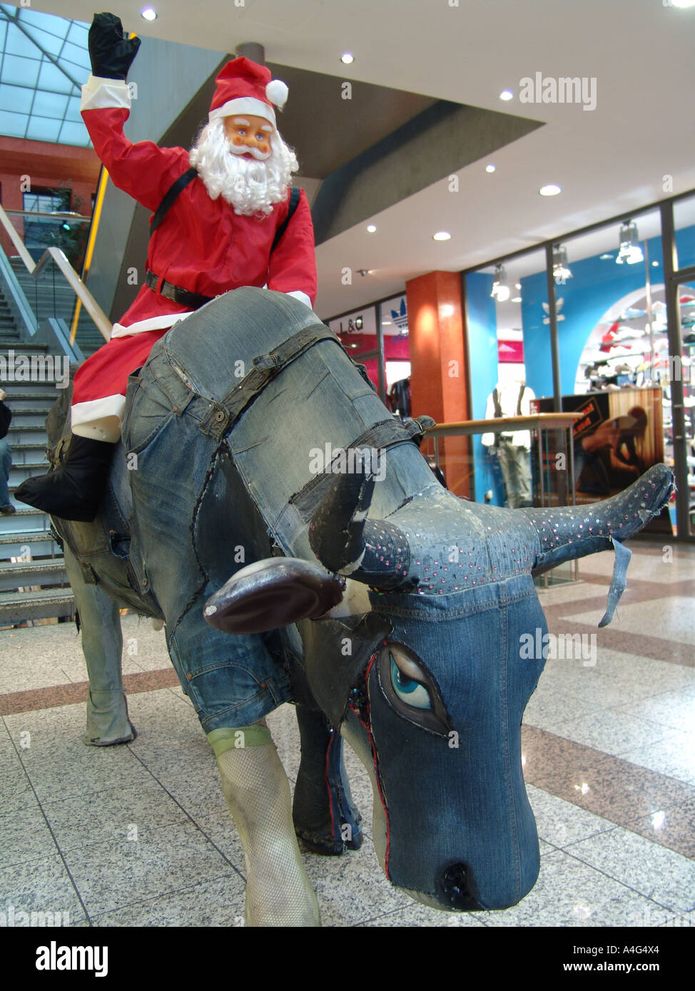 Father Christmas riding a bull in a shopping centre, Starometska ...