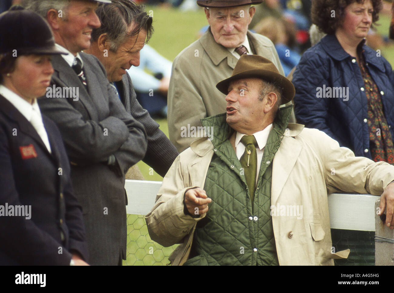 Group of people talking at a horse race meeting Stock Photo - Alamy