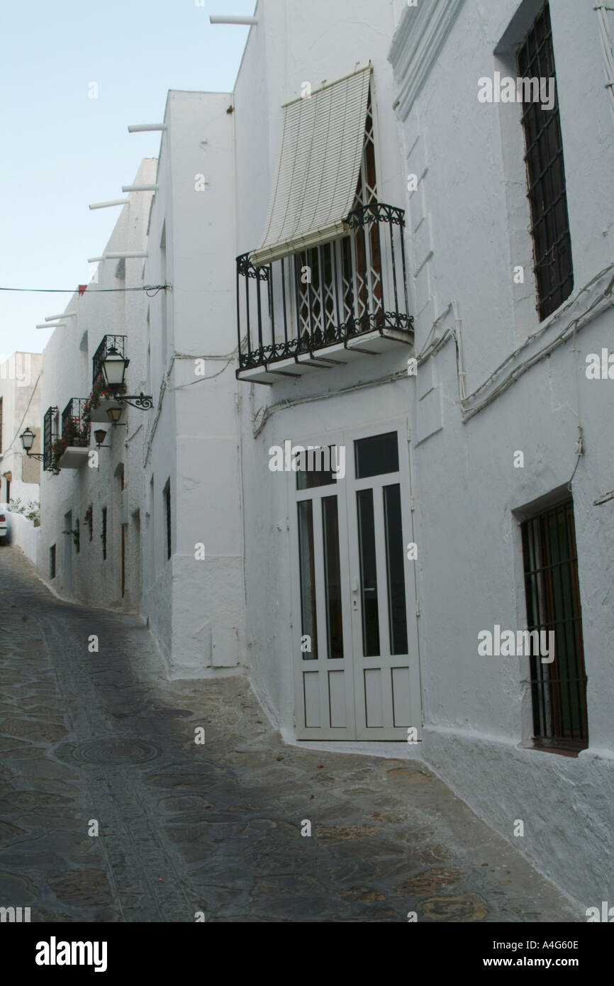 Alleyway between white houses in village of old Mojacar Andalusia Spain ...