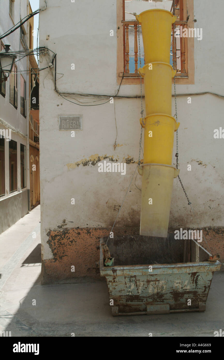 Building work with a skip Stock Photo - Alamy