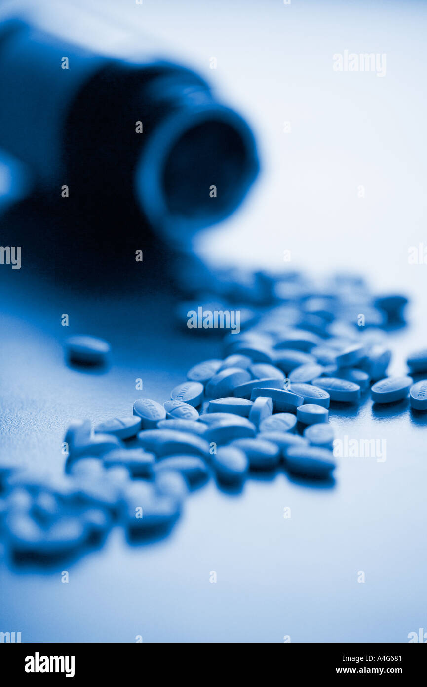 little blue pills tablets medication Stock Photo - Alamy