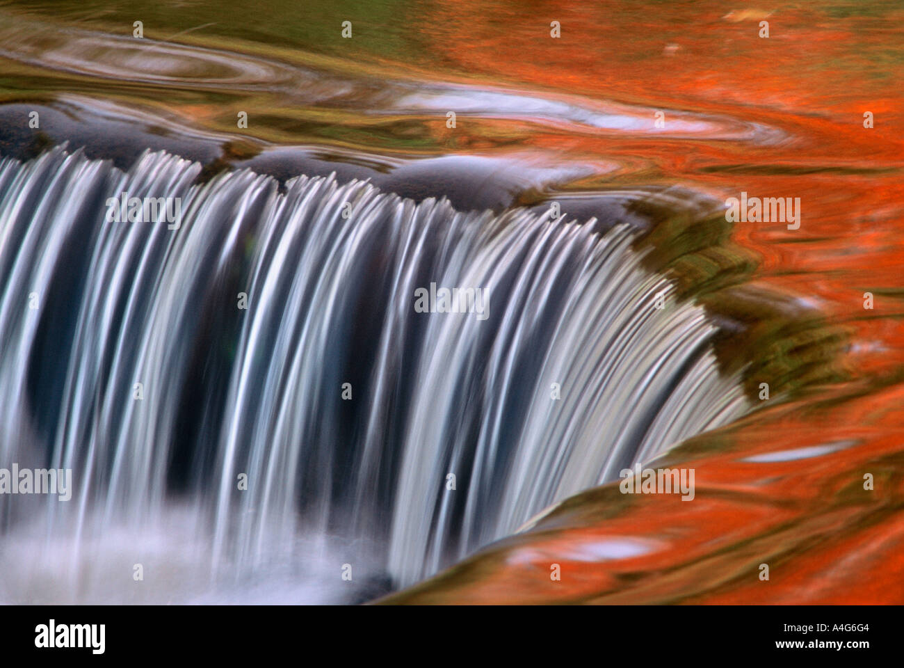 Fall colors reflecting in a waterfall in Michigan Stock Photo - Alamy