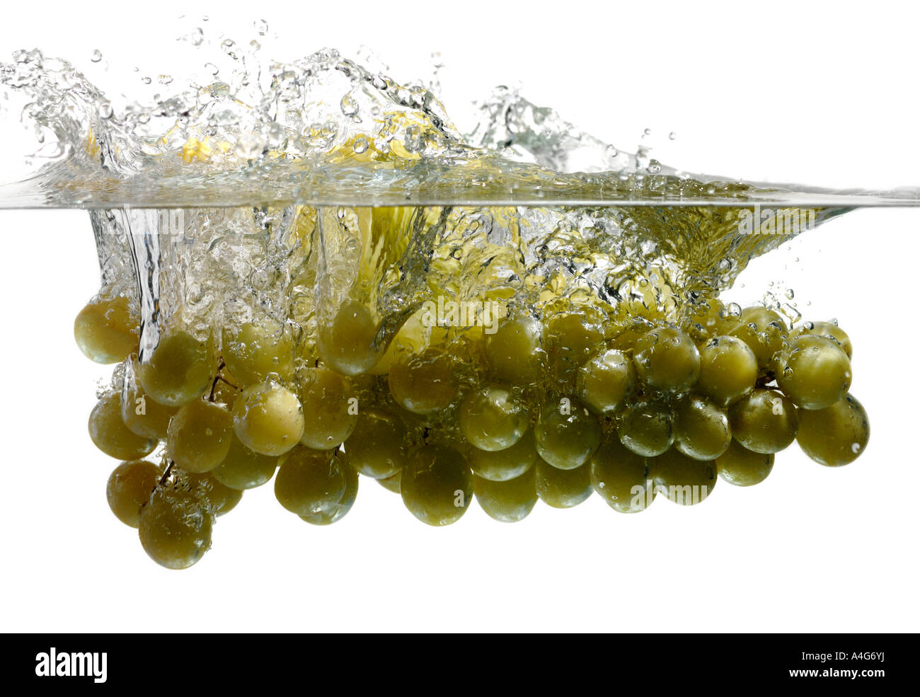 Grapes splashing into water Stock Photo - Alamy