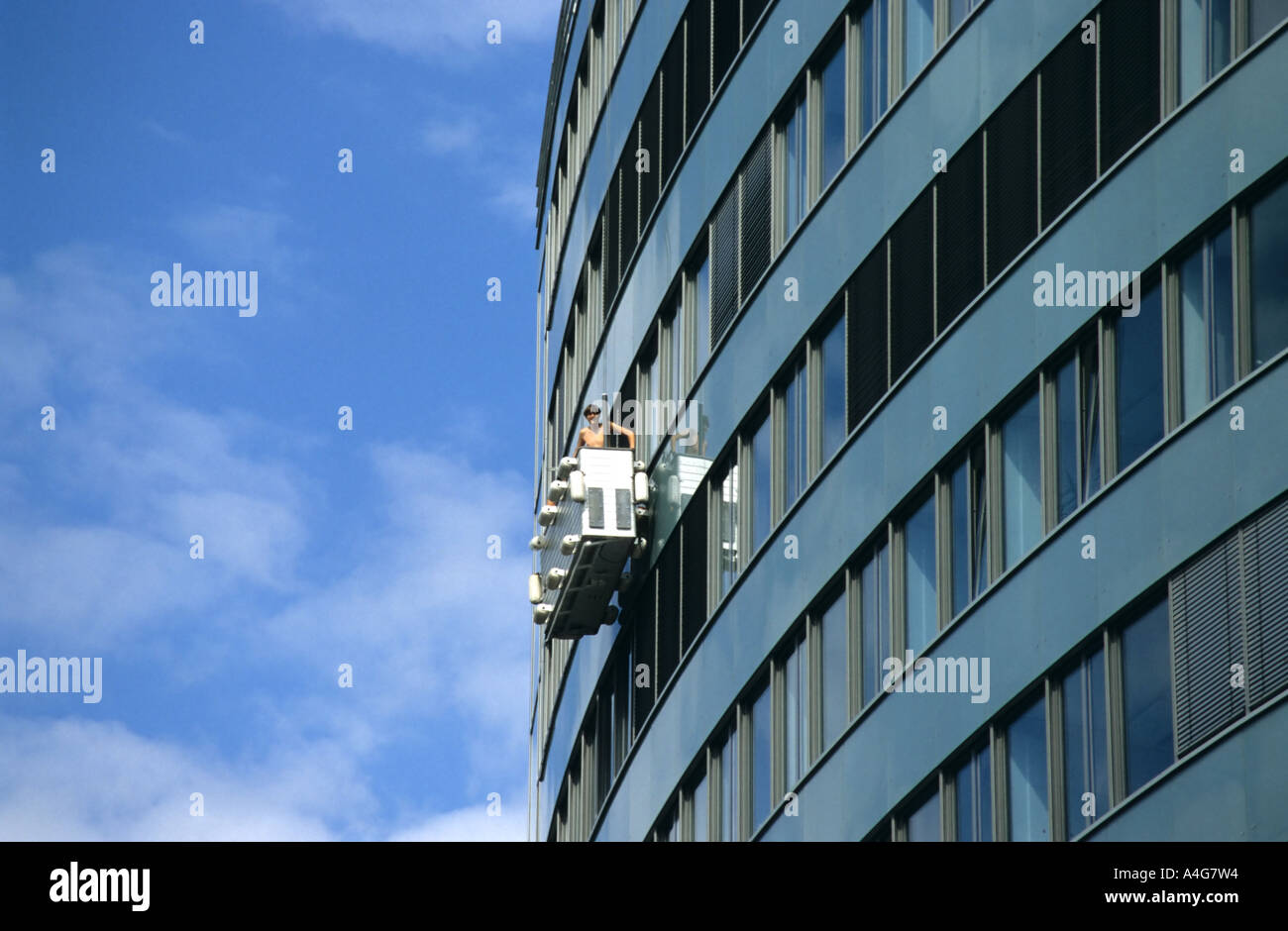Window cleaner at block of offices in Berlin, Germany Stock Photo - Alamy
