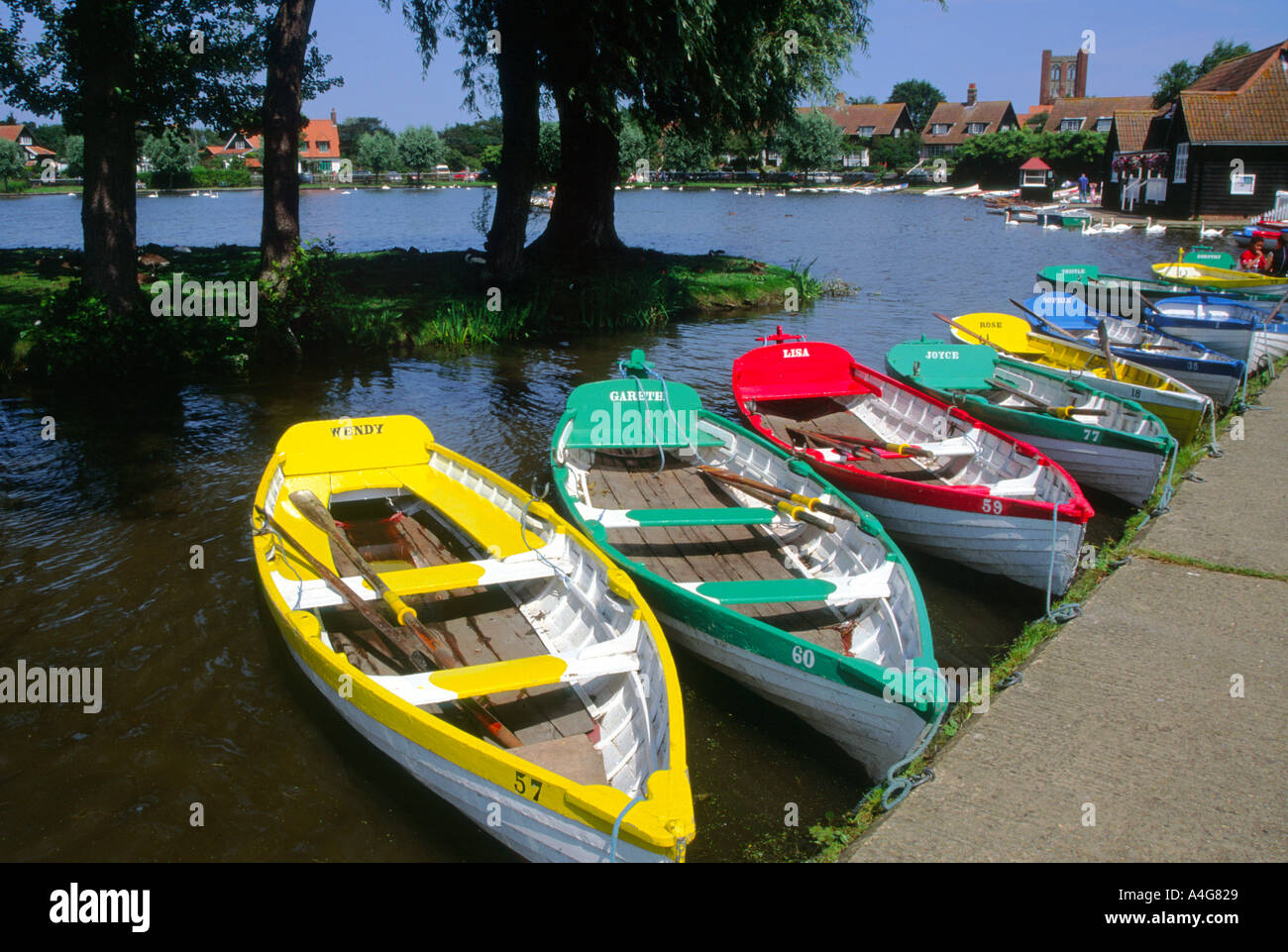 Colourful rowing boats, Thorpeness, Suffolk, England, UK Stock Photo ...