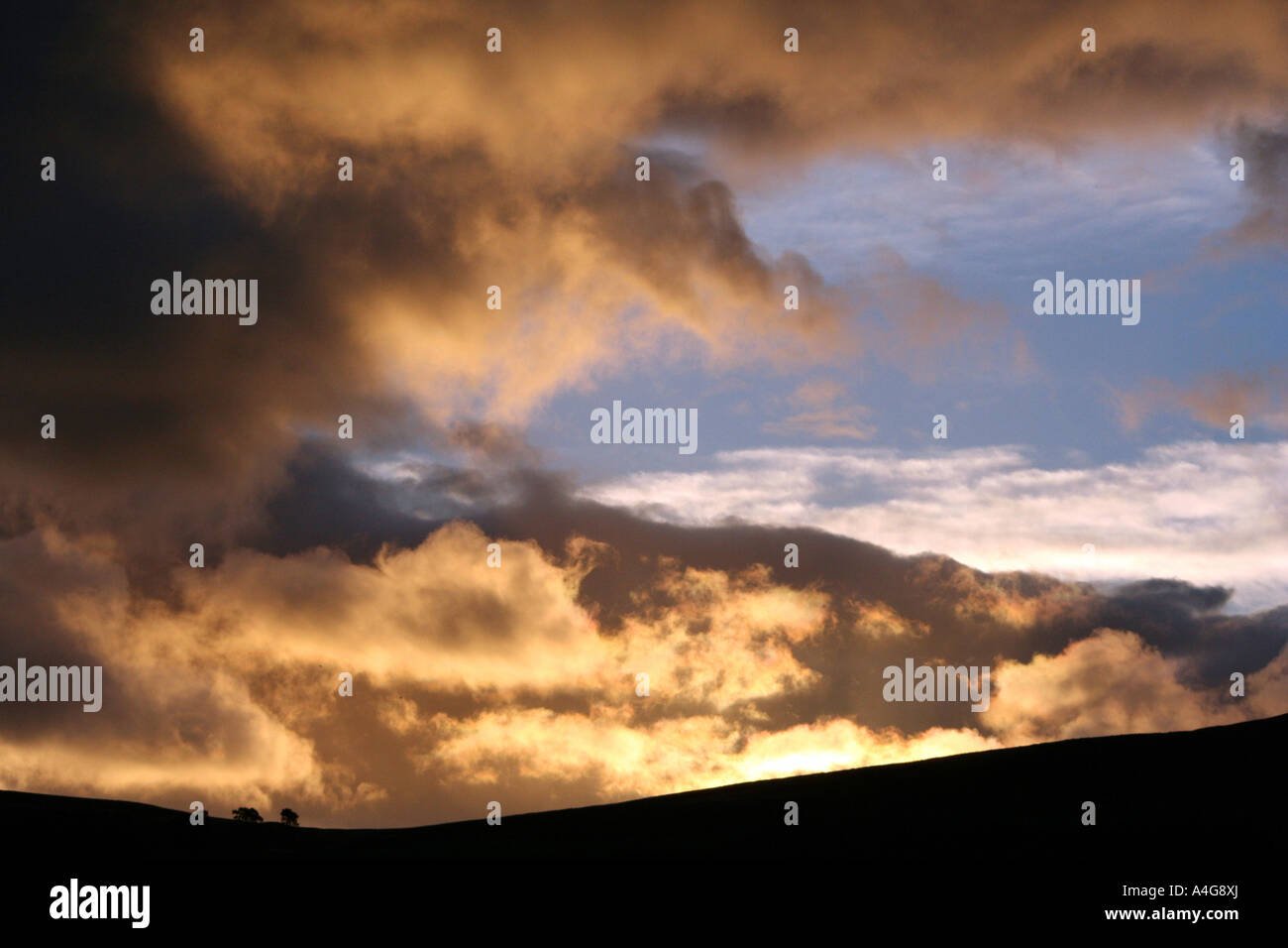 Orange evening sky and hill slant horizon silhouette, countryside Stock ...