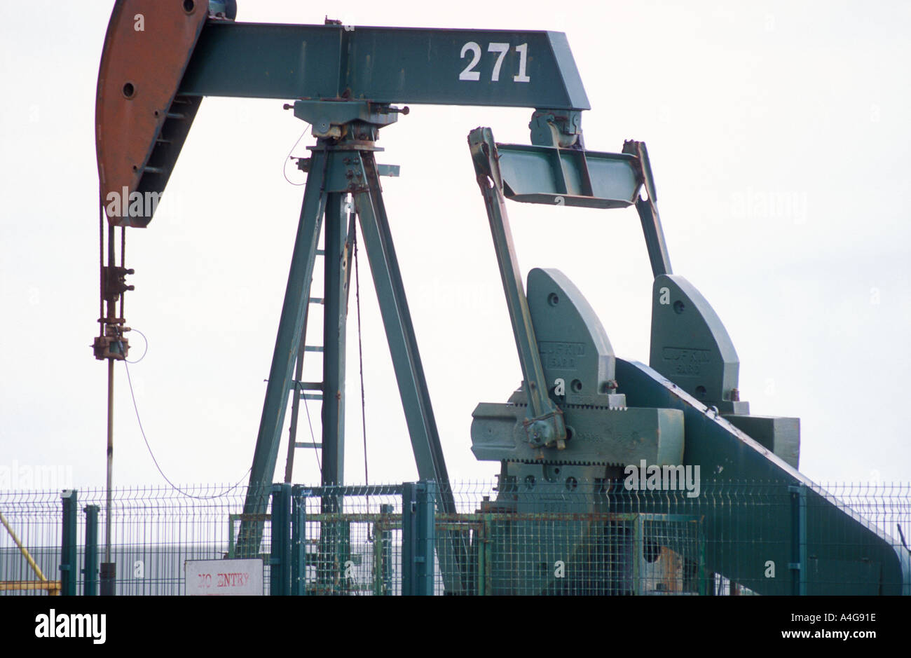 Oil Drilling Nodding Donkey pumping oil Seria Brunei Stock Photo - Alamy