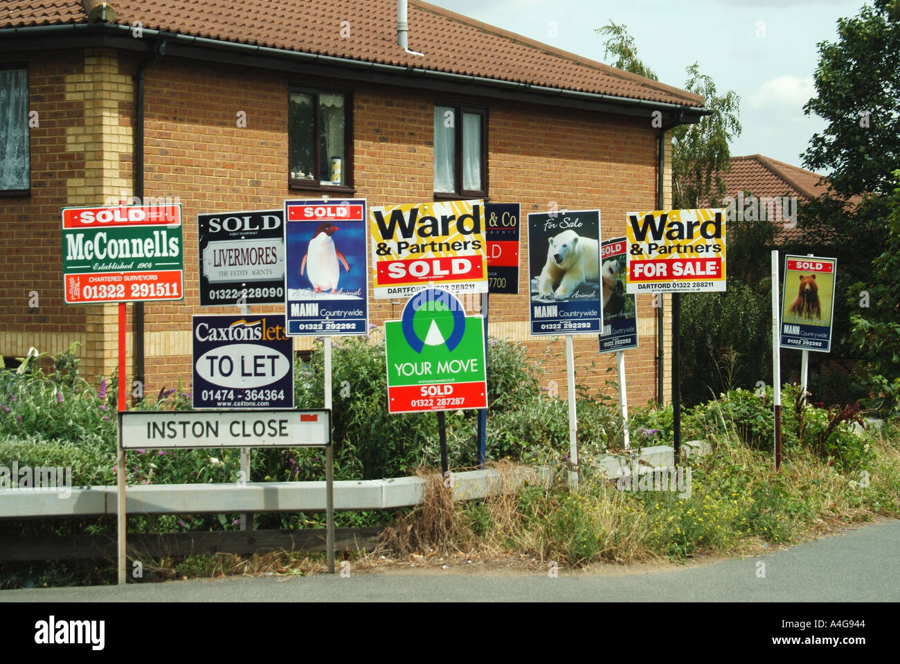 Estate and letting agents advertising boards placed at junction of ...