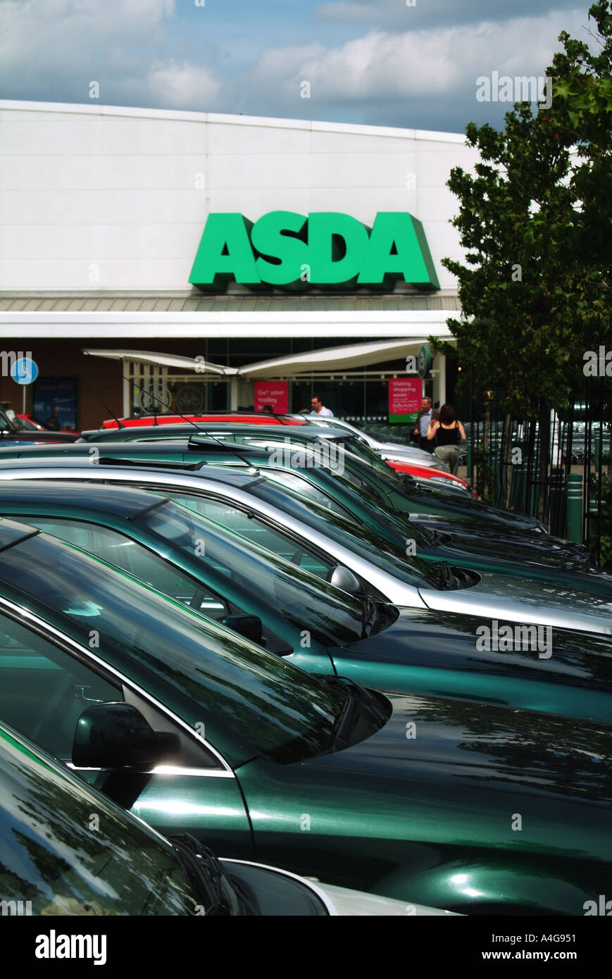 Asda supermarket store sign and entrance doors with cars parked Stock ...