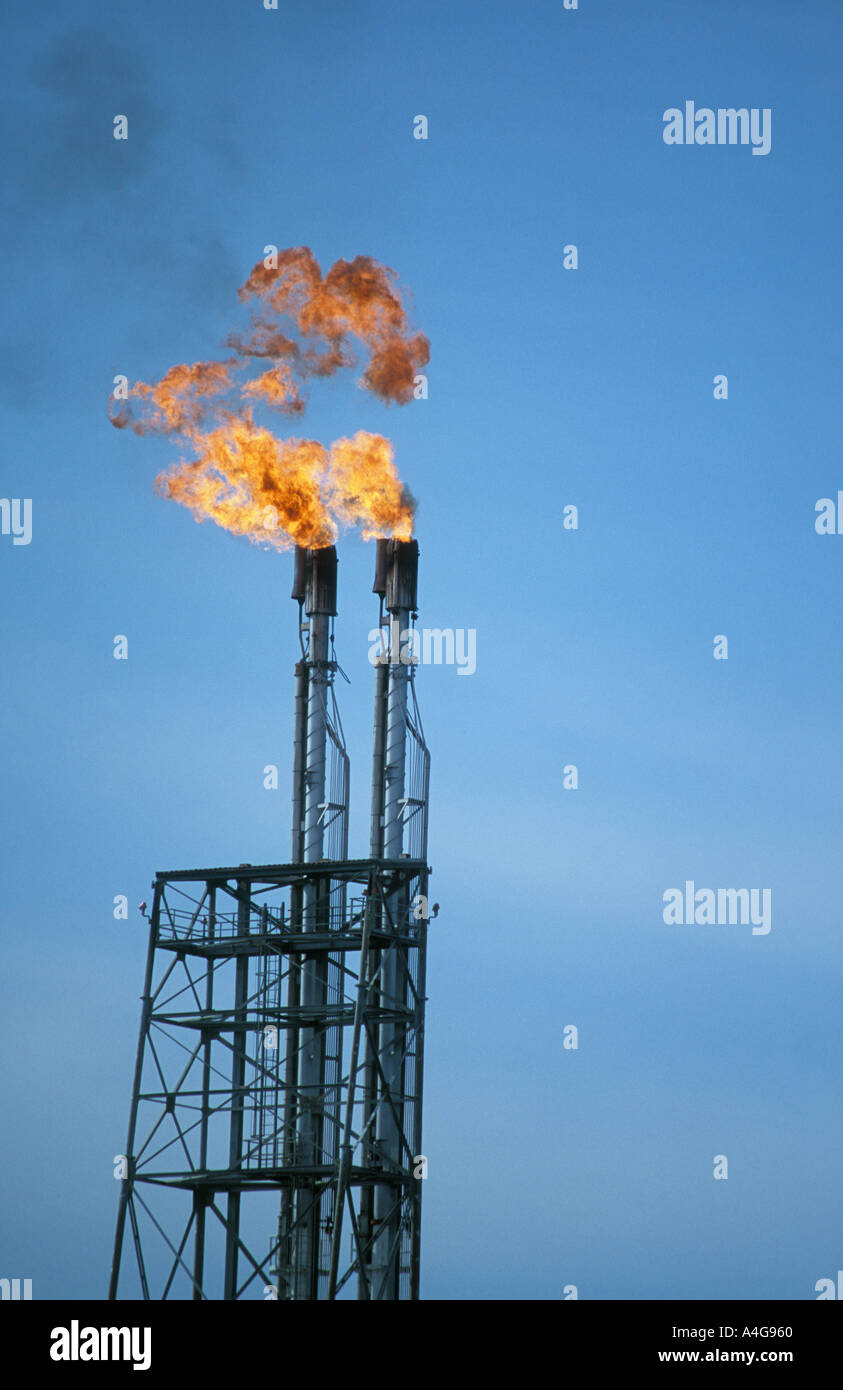 Flare stack burning gases at oil refinery Seria Brunei Stock Photo - Alamy