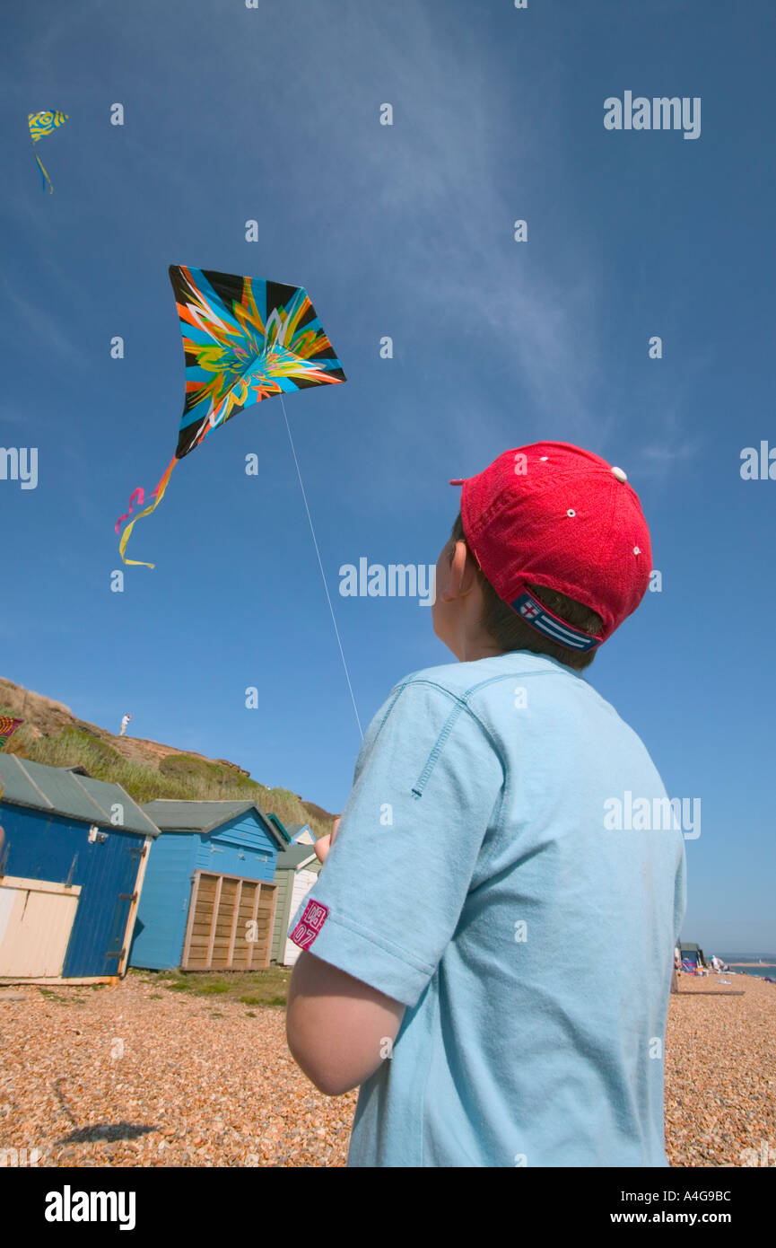 Child flying kite pulling hi-res stock photography and images - Alamy