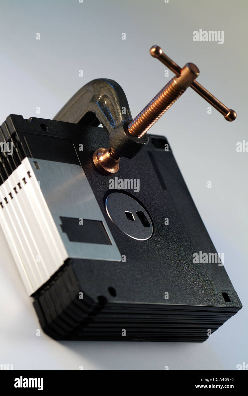 Computer Floppy Disks Compressed Together by a Clamp Stock Photo - Alamy
