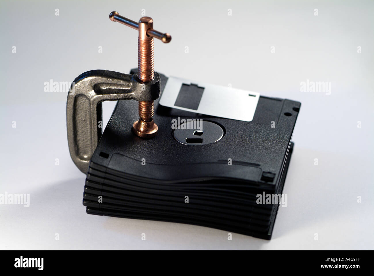 Computer Floppy Disks Compressed Together by a Clamp Stock Photo - Alamy