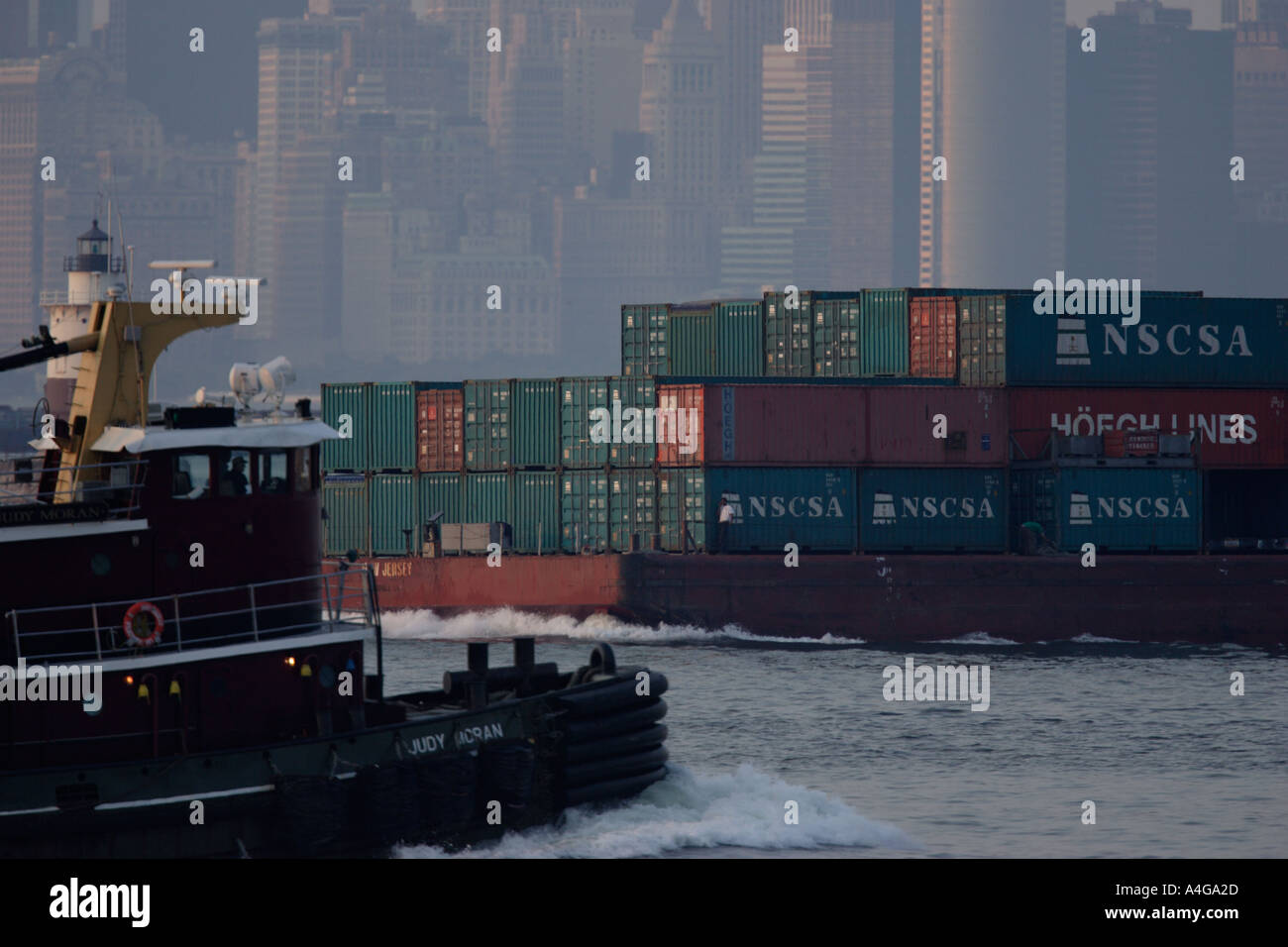 A barge with freight containers in New York harbor Stock Photo - Alamy