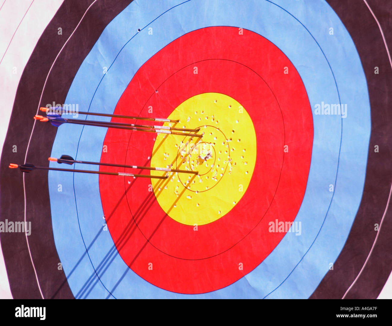 Arrows hitting a target Stock Photo - Alamy