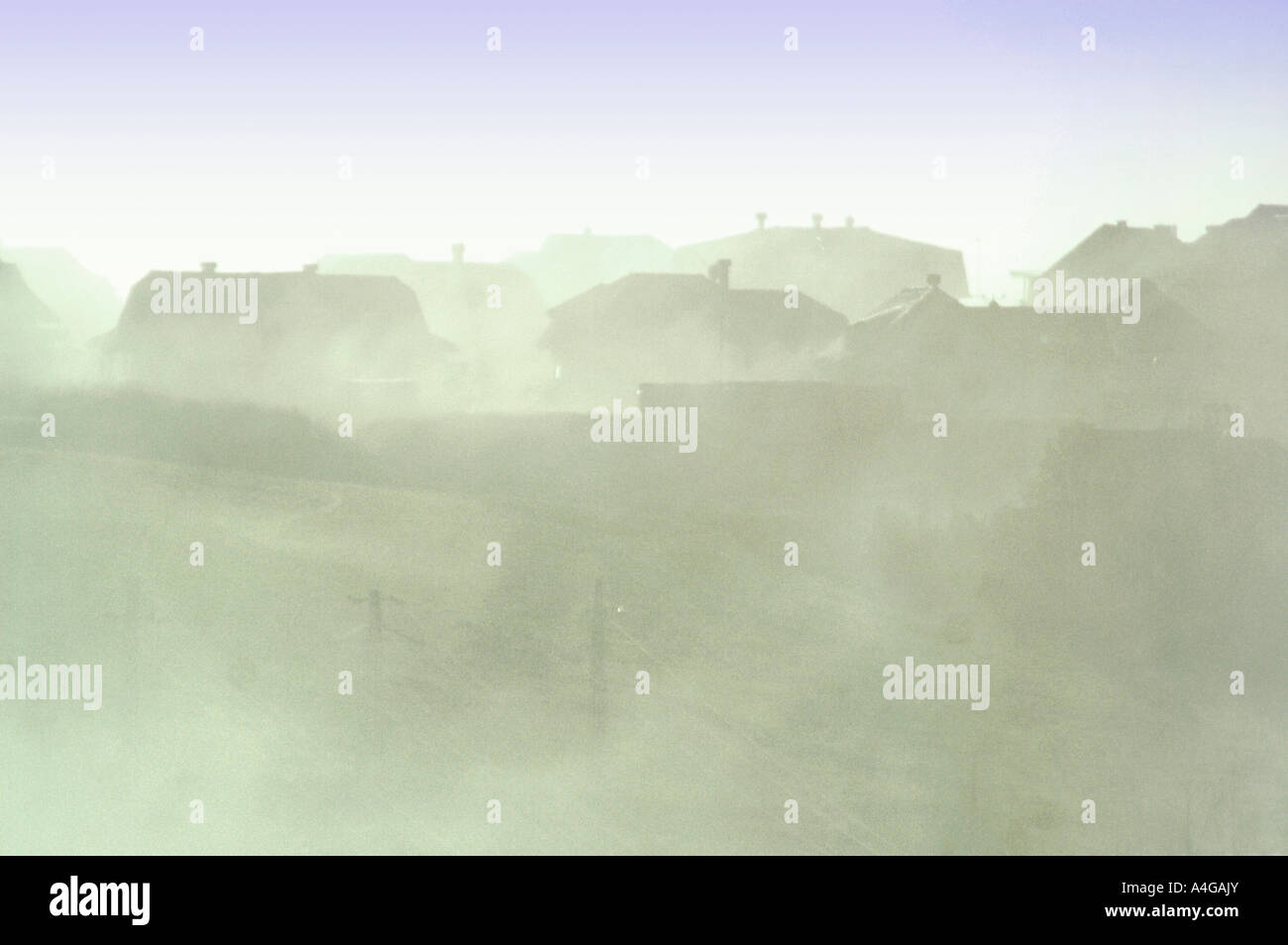 Thick white fog over family dwelling houses Stock Photo - Alamy