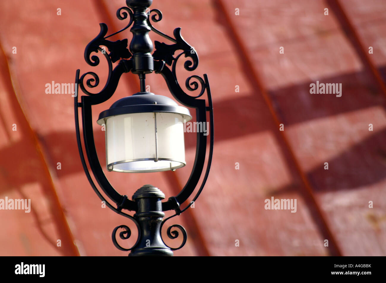 Old street light and red tin roof in Banska Bystrica, Slovakia Stock ...