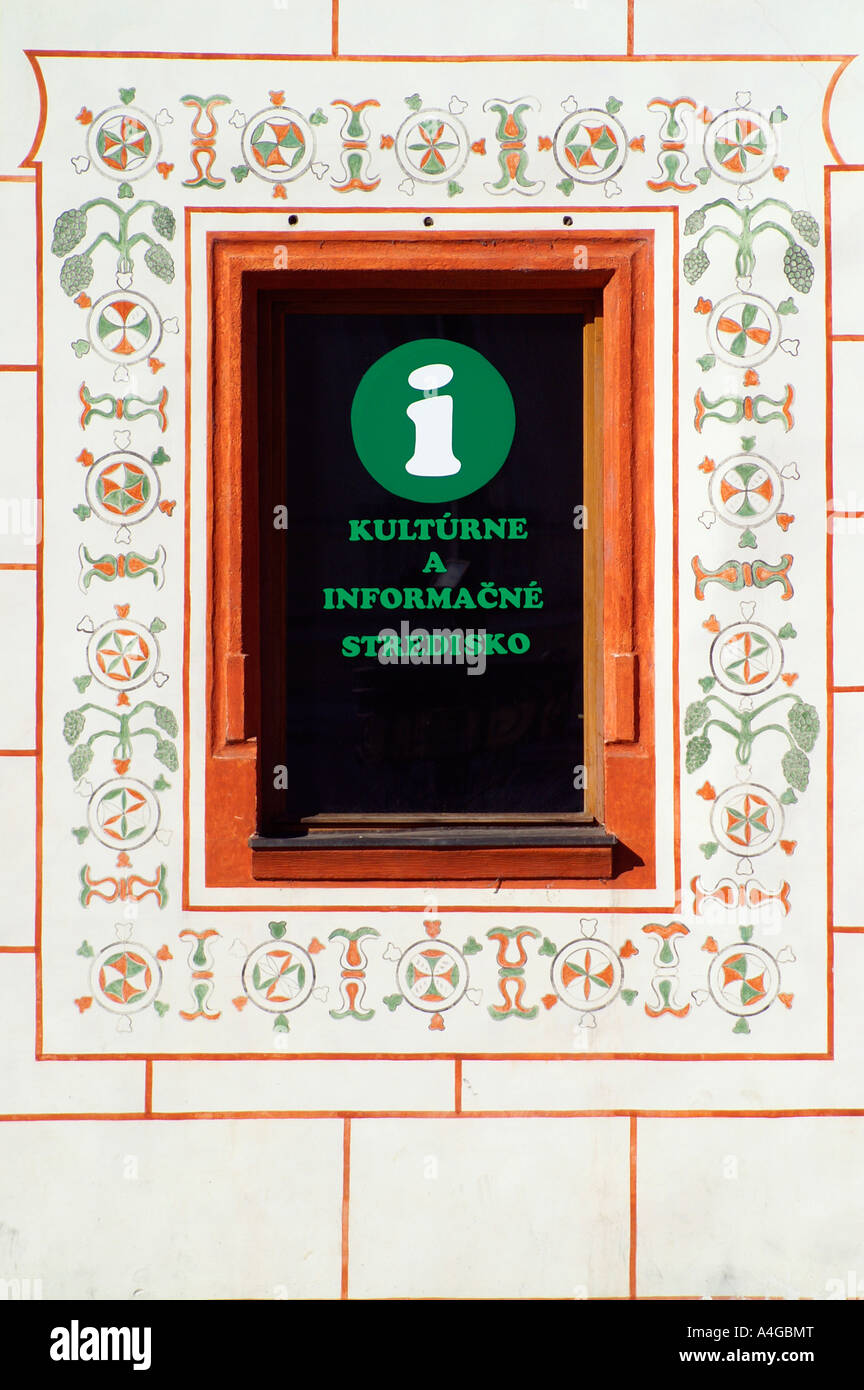 Information centre sign on window surronded by ornament on white facade ...