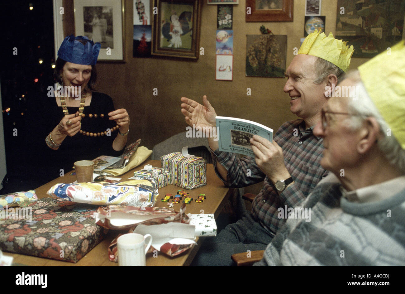 Extended family opening presents on Christmas Day Stock Photo - Alamy