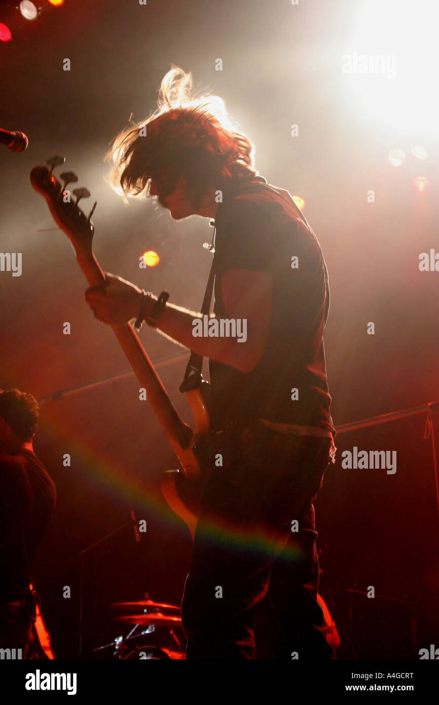 Music man in stage lights Stock Photo - Alamy