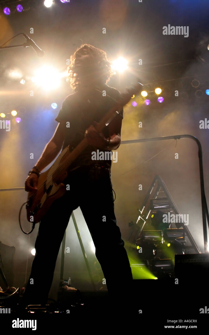 Music man in stage lights Stock Photo - Alamy